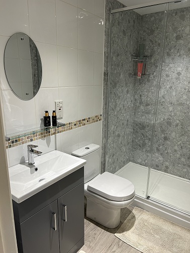 Cloakroom with sliding shower door | Anderson Kitchens and Bathrooms